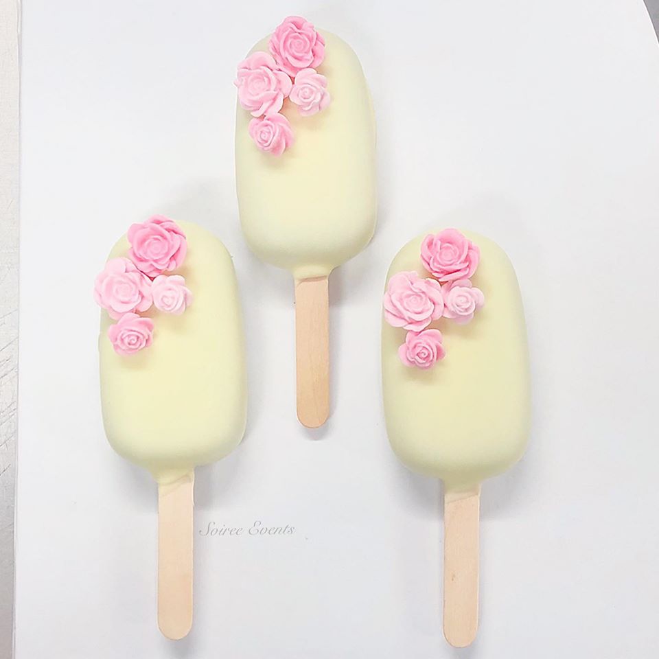 White Chocolate Coated Cake Popsicles with Pink Sugar Flowers – Soiree